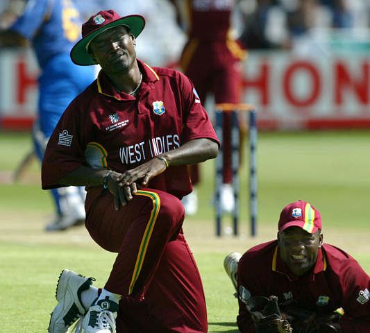 Carl Hooper and wicket-keeper Ridley Jacobs react after missing a ball ...