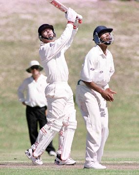 Graham Lloyd skies one over the field during his innings of 50 ...
