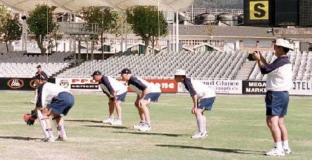 Lancashire coach Bobby Simpson keeps a close eye on his players ...