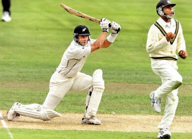Adam Parore drives the ball into Faisal Iqbal | ESPNcricinfo.com