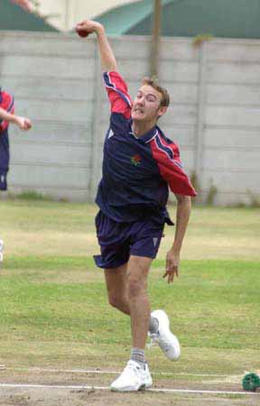 Chris Schofield practices his bowling before the game v Boland ...