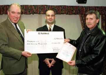 Ramsbottom officials receiving cheque from Sir Robert Atkins ...