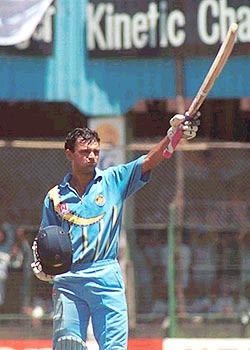Hemang Badani raises his bat on reaching his hundred | ESPNcricinfo.com