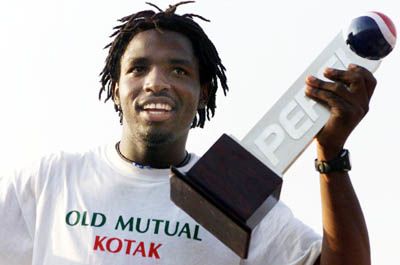 Douglas Hondo holds up his Man of the Match award at Kochi ...