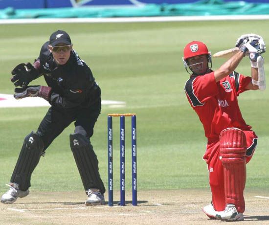 Davison goes down on one knee to play a lofted drive at Benoni ...
