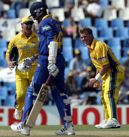 Brett Lee celebrates with team-mate Andy Bichel after dismissing ...