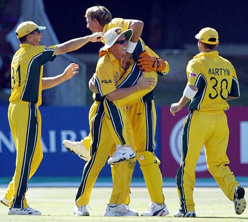 Bichel is lifted off his feet by team-mate Brett Lee after the ...