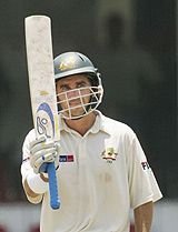 Justin Langer raises his bat after his century | ESPNcricinfo.com