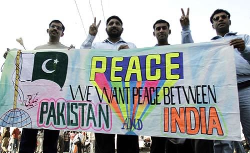 Pakistani cricket fans hold a banner in favour of the Indian-Pakistan ...
