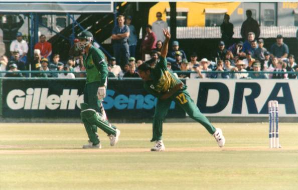 Roger Telemachus in action, the non-striking batsman is Mohammad Wasim ...