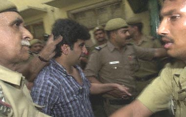 Suspected Indian bookmaker Kishan Kumar is led out of court ...