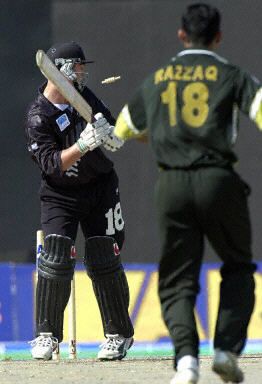Matthew Sinclair faces his shattered stumps after being clean bowled by ...