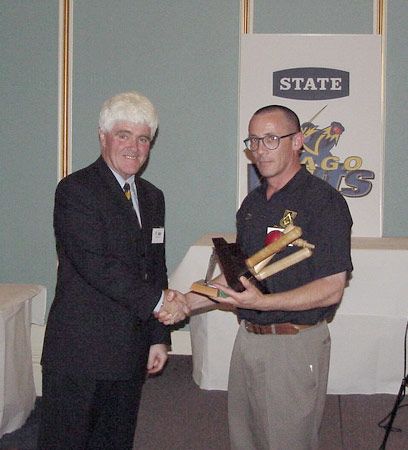 Morris is presented an award for his outstanding contribution to Otago ...