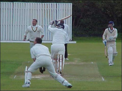 Mark Aspin swings Steve Juliff over square leg for six in Church's ...