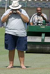 Andy Atkinson takes a snapshot of the pitch | ESPNcricinfo.com
