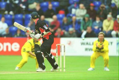 Adrian Dale turns to see Shane Warne catch him out for one ...
