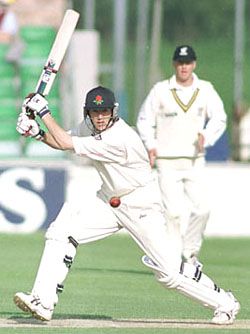 Chris Schofield plays a square drive during his half century against ...
