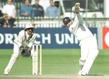 Warren Hegg comes down the wicket and lofts the ball over the infield ...