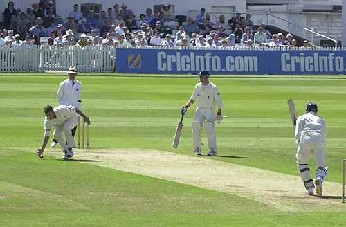 Ostler belts the ball back past Greg Smith | ESPNcricinfo.com