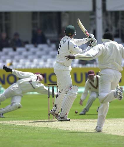 Darren Bicknell edges an Anderson delivery short of the diving Toby ...