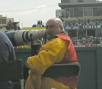 A cricket photographer without any head wear | ESPNcricinfo.com