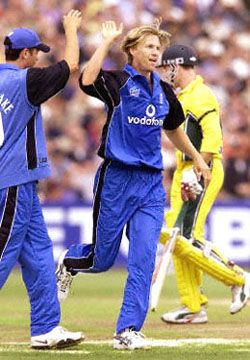 Alan Mullally celebrates with Ben Hollioake after dismissing Michael ...