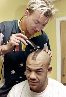 Australian fast bowler Brett Lee gives Andrew Symonds a Mohawk haircut ...
