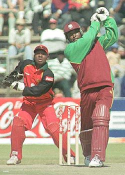 Carl Hooper launches furiously into a lofted drive | ESPNcricinfo.com