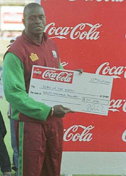 Cameron Cuffy displays his Man of the Match cheque | ESPNcricinfo.com