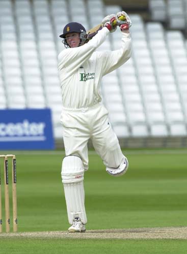 Chris Bassano of Derbys whacks a four off the bowling of Richard Logan ...