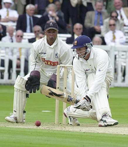 Andy Flower with a nice orthodox sweep in front of keeper Keith Piper ...