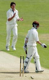 Jonathan Batty is bowled by a delighted Jon Lewis | ESPNcricinfo.com