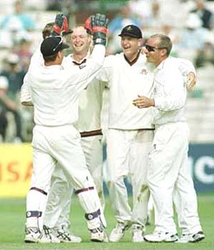 Gary Yates celebrates with team mates after running out Anthony McGrath ...