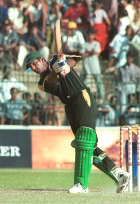 Yousuf Youhana steps out to drive the ball | ESPNcricinfo.com