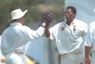 Ntini congratulated by Boucher after picking up the wicket of Atapattu ...