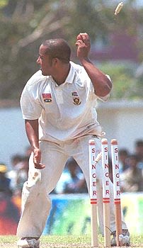 Paul Adams whips the bails off and finds Russel Arnold short of his ...