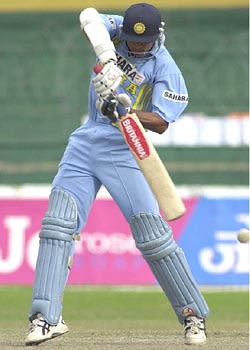 Hemang Badani slices the ball through the off side in the course of his ...