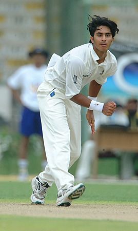 Kuwait's Sajid Ashraf in his follow through | ESPNcricinfo.com