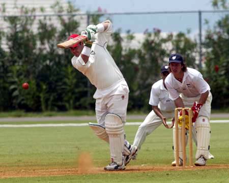 Ian Billcliff (Canada) drives against Argentina. The keeper is ...