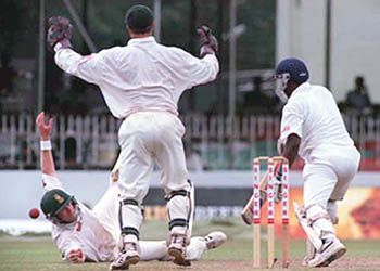 Boucher looks on helplessly as the ball off Jayasuriya's bat drops just ...