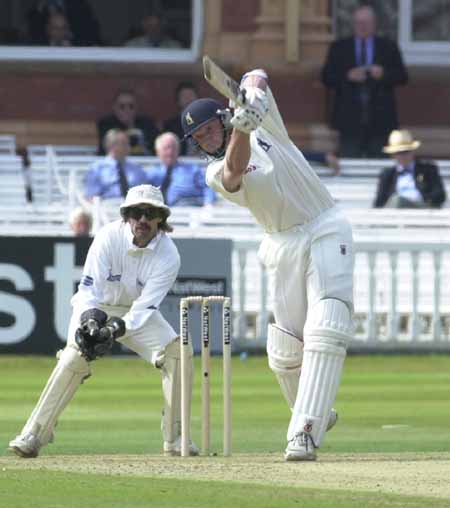 A firm drive from Dominic Ostler to add 2 runs to Warwickshire's total ...