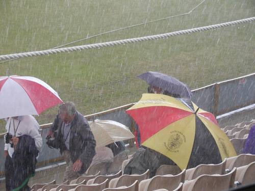 The crowd takes shelter from the hail | ESPNcricinfo.com
