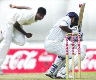 Sameer Dighe ducks underneath a bouncer from Fernando and the ball ...