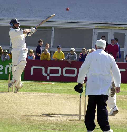 Nasser Hussain hooks a ball from Lee on his way to a score of 55 ...