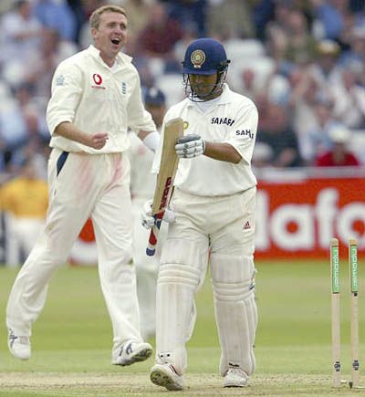 Sachin Tendulkar walks off after pulling one from Dominic Cork onto his ...