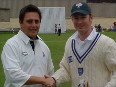 Good pals Mark Higgs and Michael Clarke meet up before the match ...
