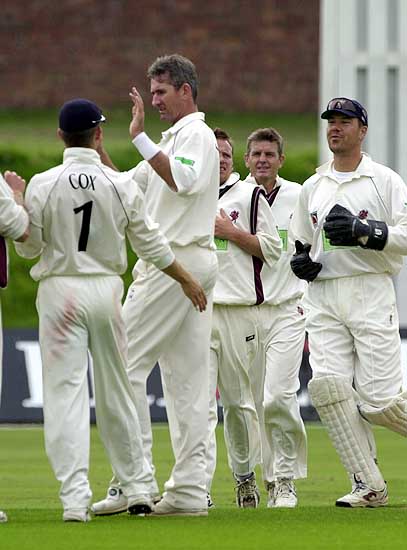 Andy Caddick gets the congratulations after having Swann caught by ...