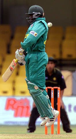 A Kenyan bat safely negotiates a short delivery against Pakistan at ...