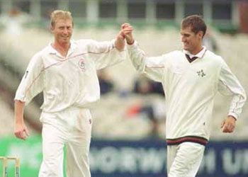 Glen Chapple celebrates taking a wicket with Mark Chilton ...