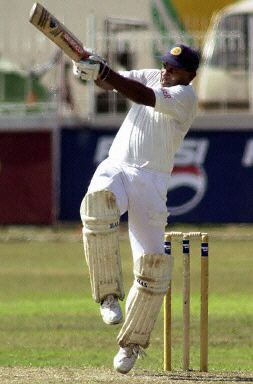 Sanath Jayasuriya pulls the ball powerfully towards the mid-wicket ...